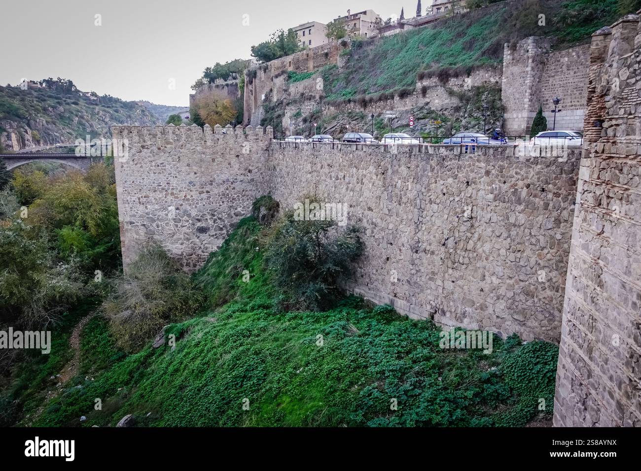 Description: Stone fortification with crenellations and towers, part of ...