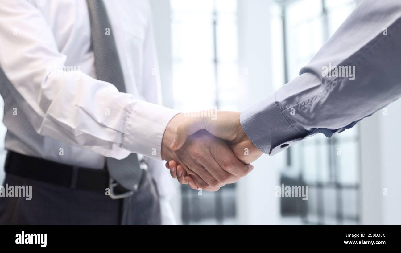 Handshake and congratulations after the transaction Stock Photo - Alamy