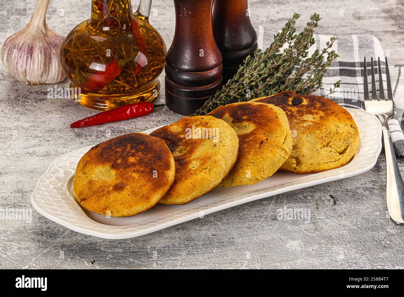 Georgian cuisine - yellow Corn bread Mchadi Stock Photo - Alamy