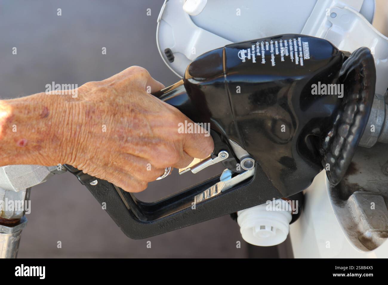 Senior Man Pumping Gas At Service Station Stock Photo - Alamy