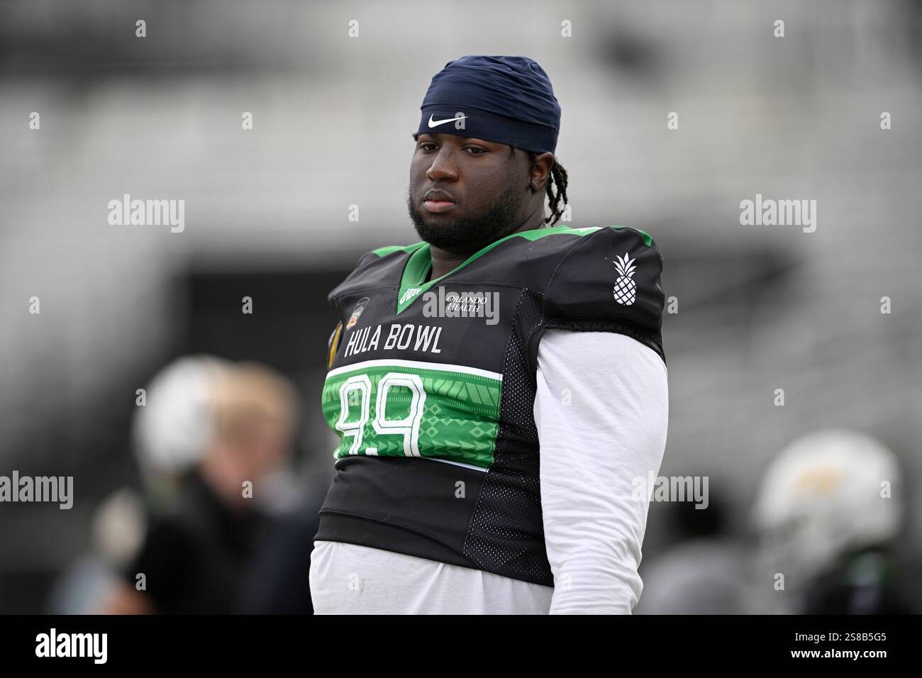 Team Aina defensive tackle Fatorma Mulbah (99), of West Virginia, warms ...