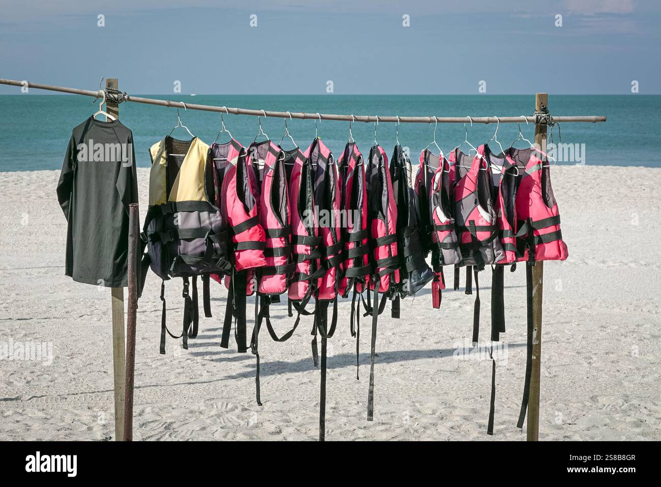 Life safety jackets hanging by the seaside. Sport activity concept ...