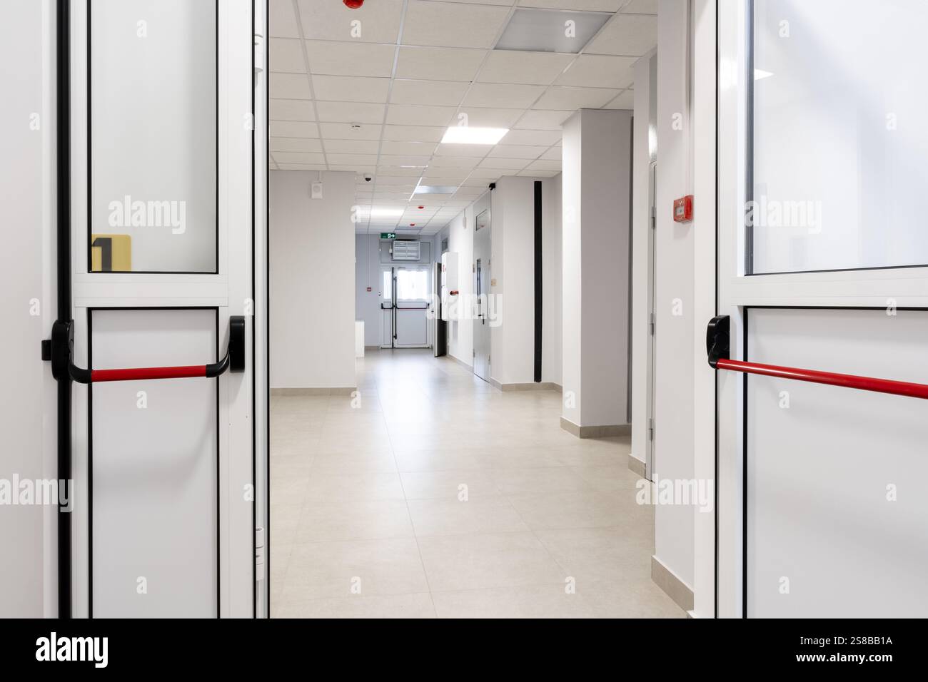 Modern hospital corridor showcasing clean lines and bright lighting in ...