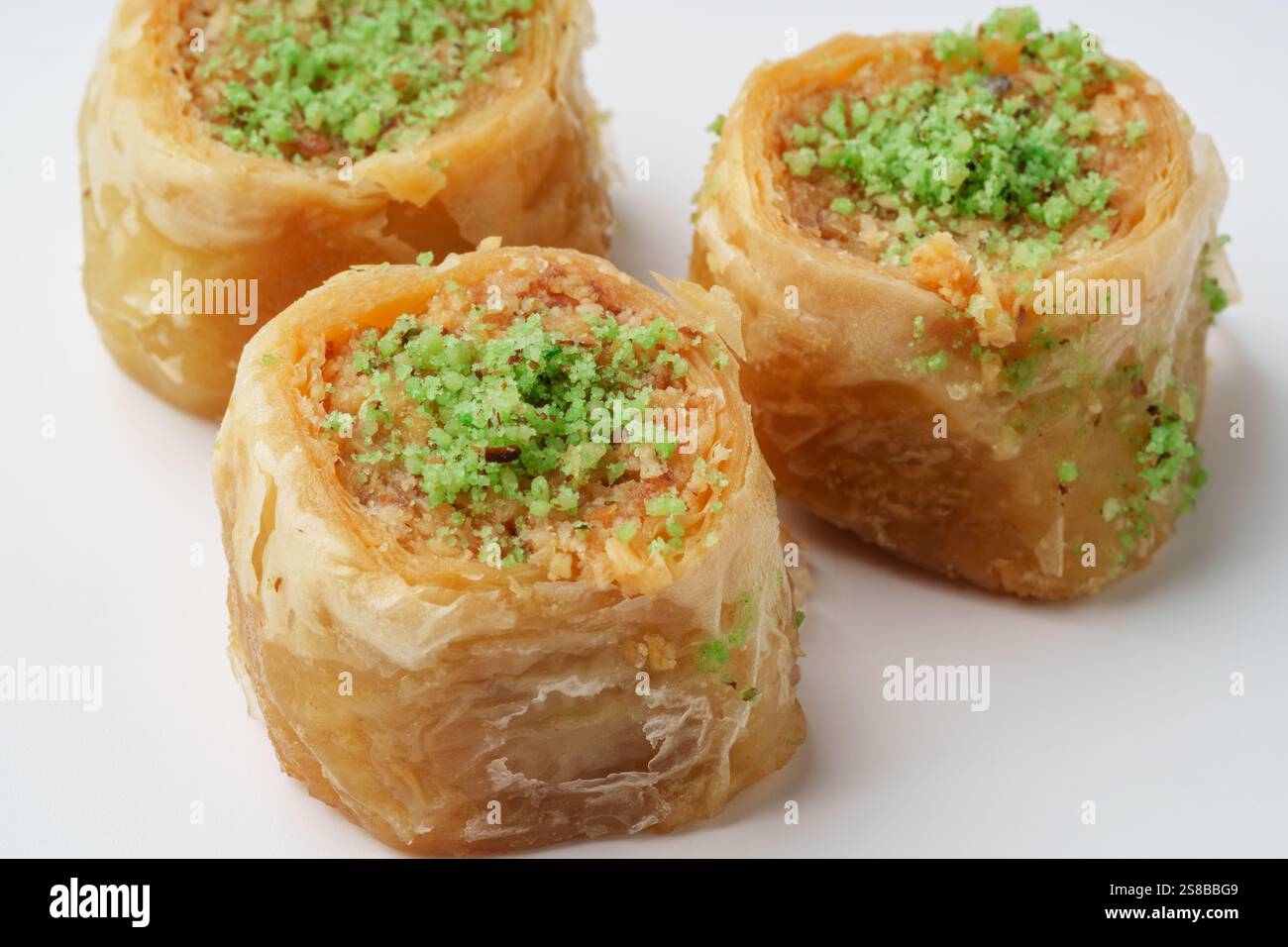 Delightful layers of baklava filled with nuts and topped with green ...