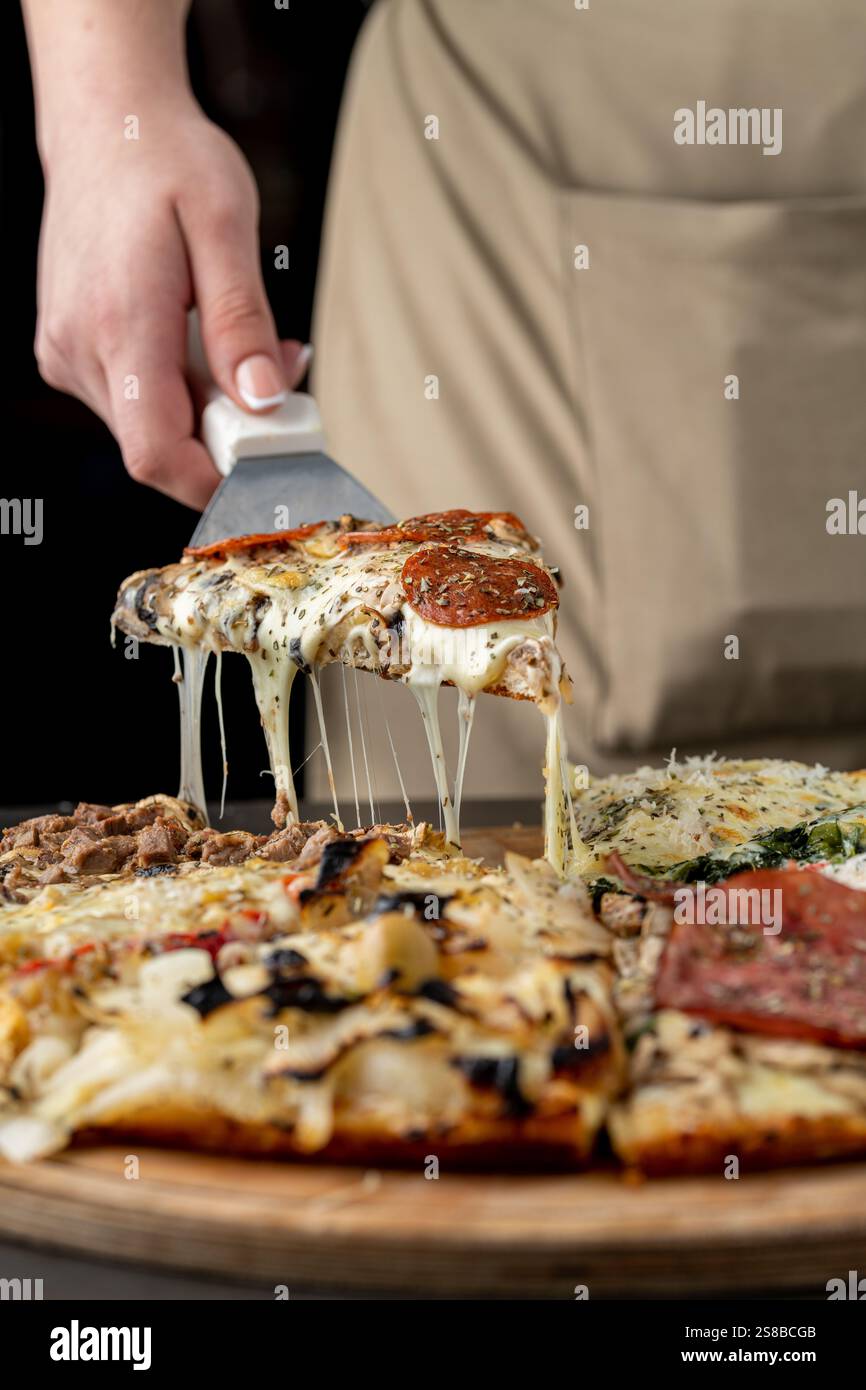 Assorted handmade Argentinian pizza on wooden background Stock Photo ...