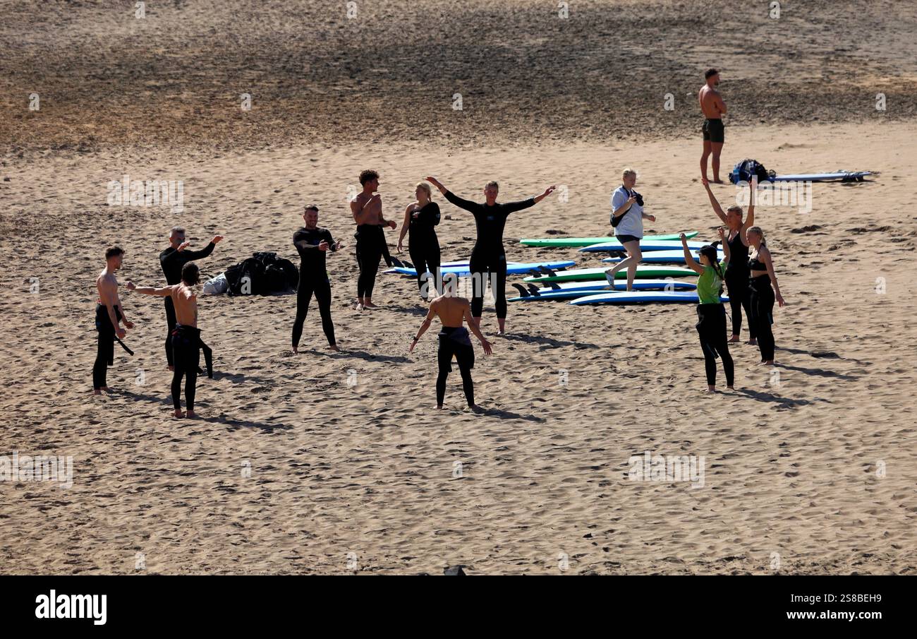 Surf school doing warm up exercises, Playa Piedra surf beach, El ...