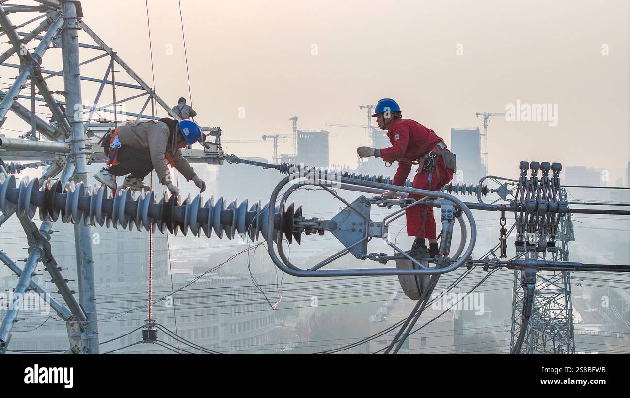 SUZHOU, CHINA - JANUARY 22, 2025 - Electric power workers upgrade ...