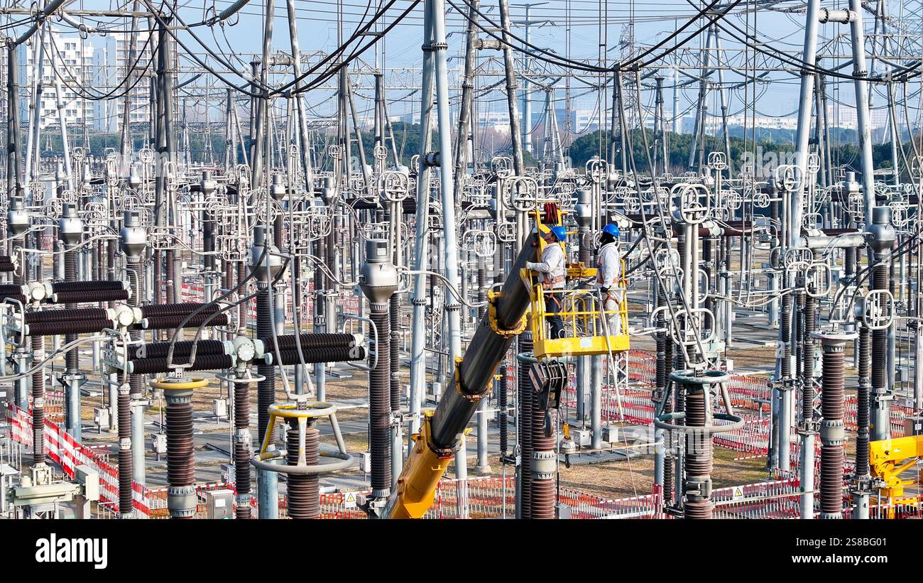 SUZHOU, CHINA - JANUARY 22, 2025 - Electric power workers upgrade ...