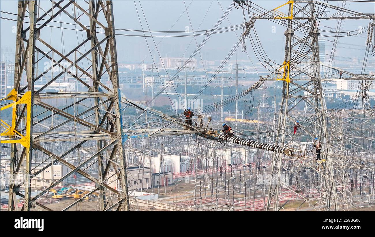 SUZHOU, CHINA - JANUARY 22, 2025 - Electric power workers upgrade ...