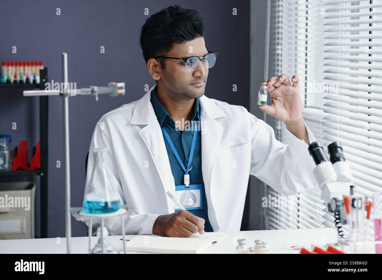 Indian Scientist Examining Substance In Laboratory Environment Stock ...