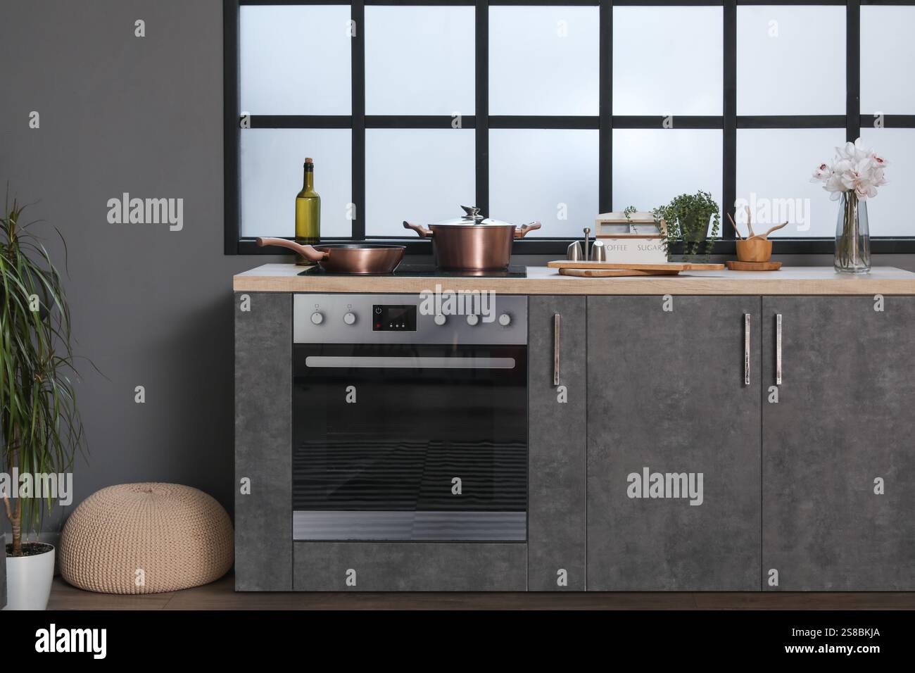 Interior of modern kitchen with grey counters and electric oven Stock ...