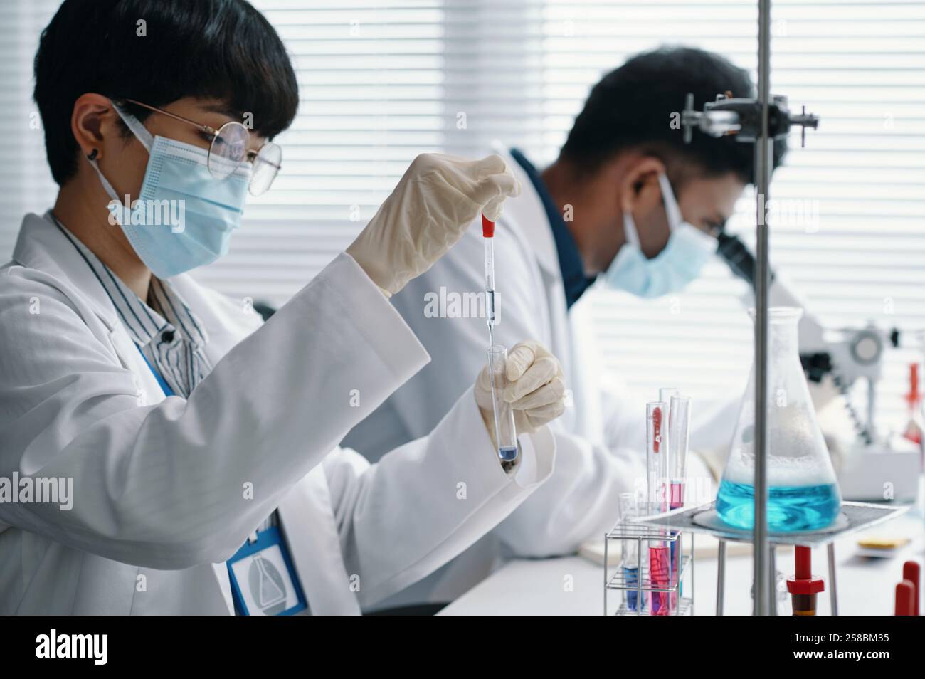 Scientists Conducting Experiments in Modern Laboratory Stock Photo - Alamy