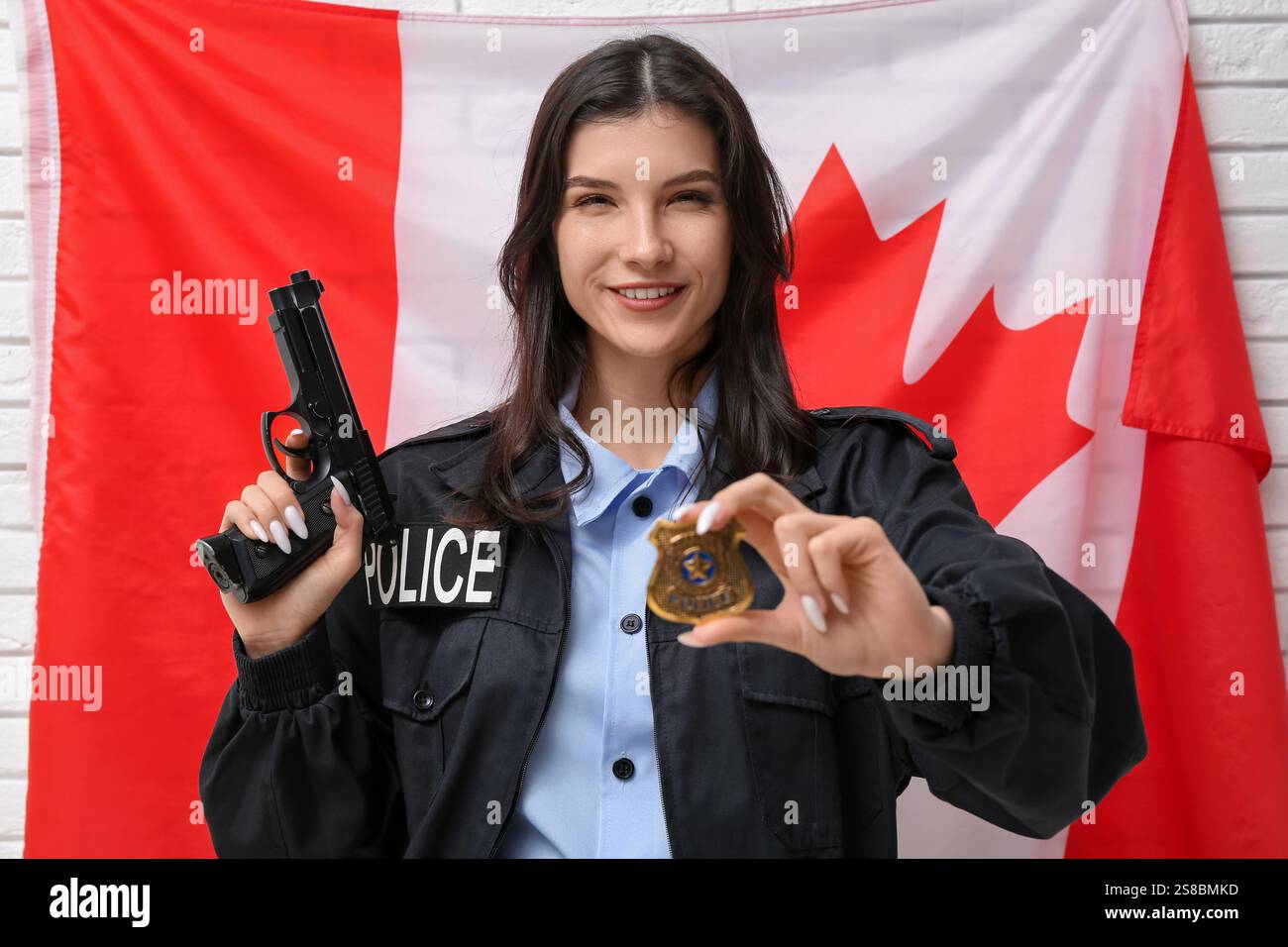 Female police officer with gun and shield against flag of Canada Stock ...