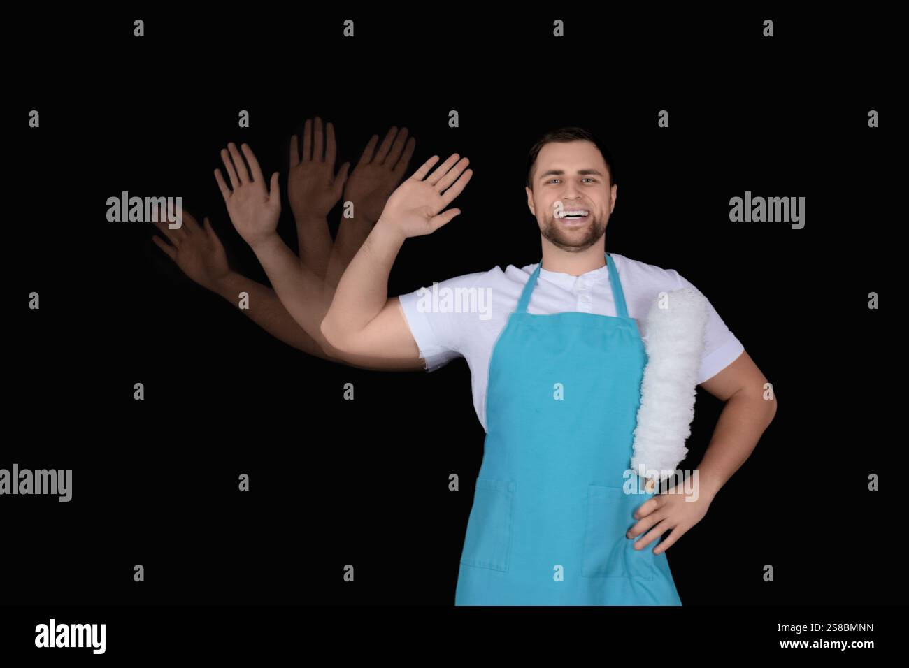 Stroboscopic photo of male janitor waving hand on dark background Stock ...