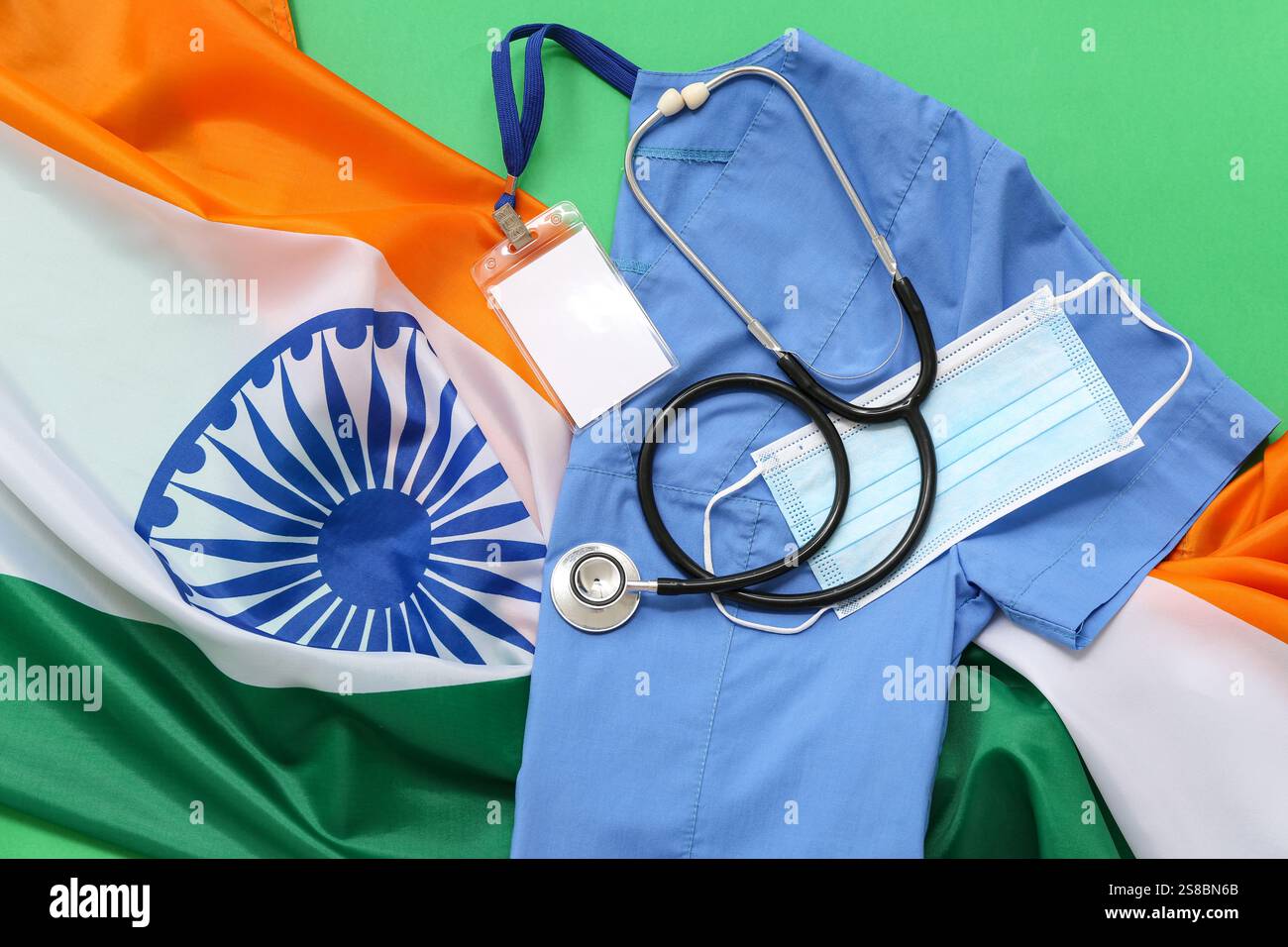 Doctor's uniform, medical mask, stethoscope and flag of India on green ...