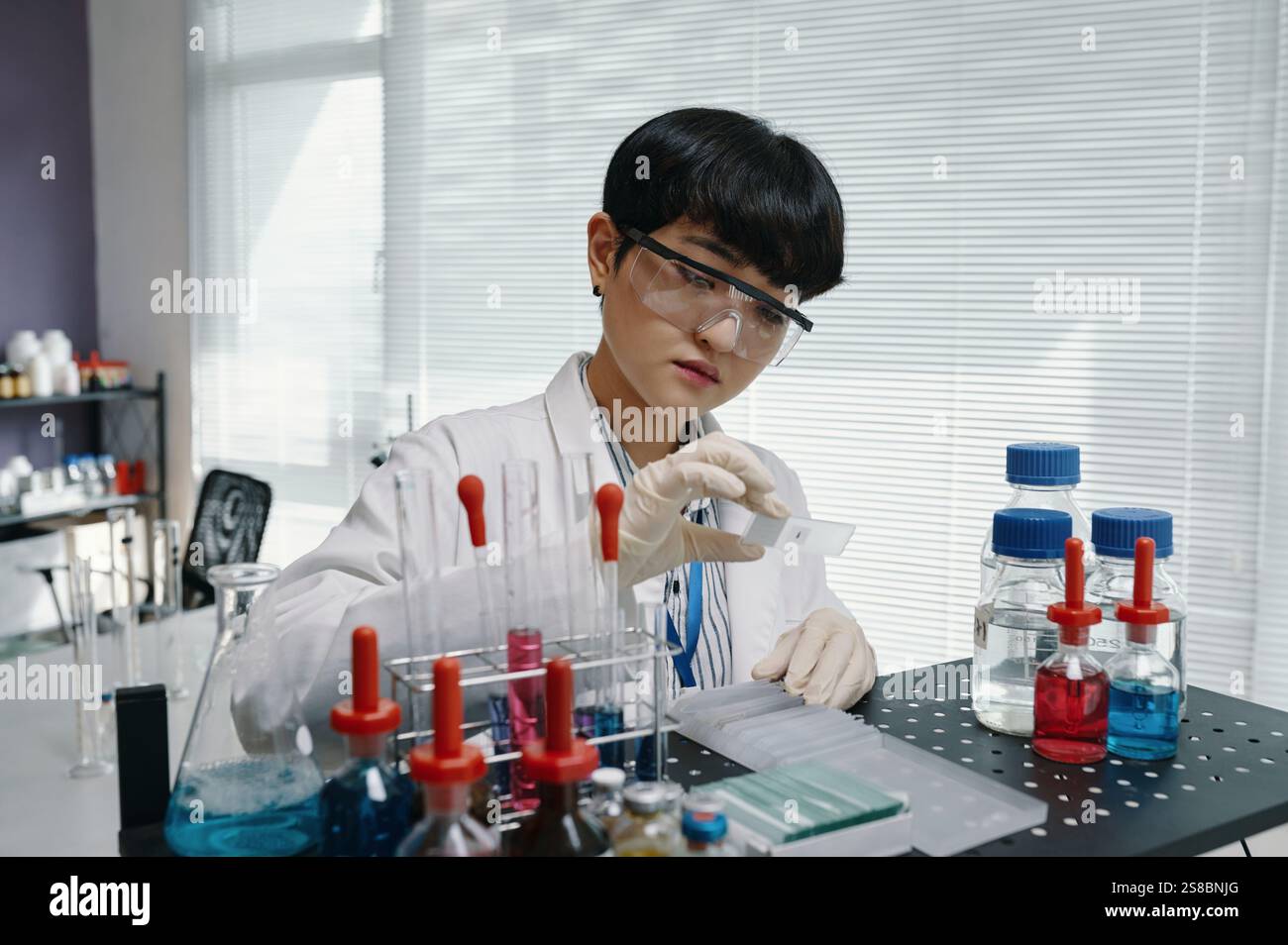 Conducting Laboratory Experiment in Controlled Environment Stock Photo ...