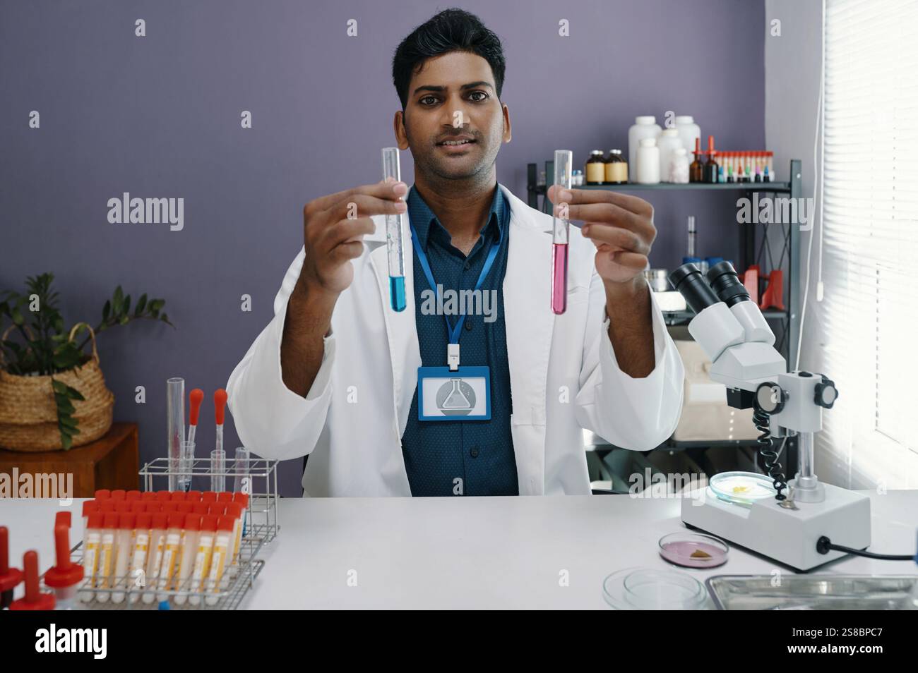 Portrait of Scientist Holding Test Tubes in Laboratory Stock Photo - Alamy