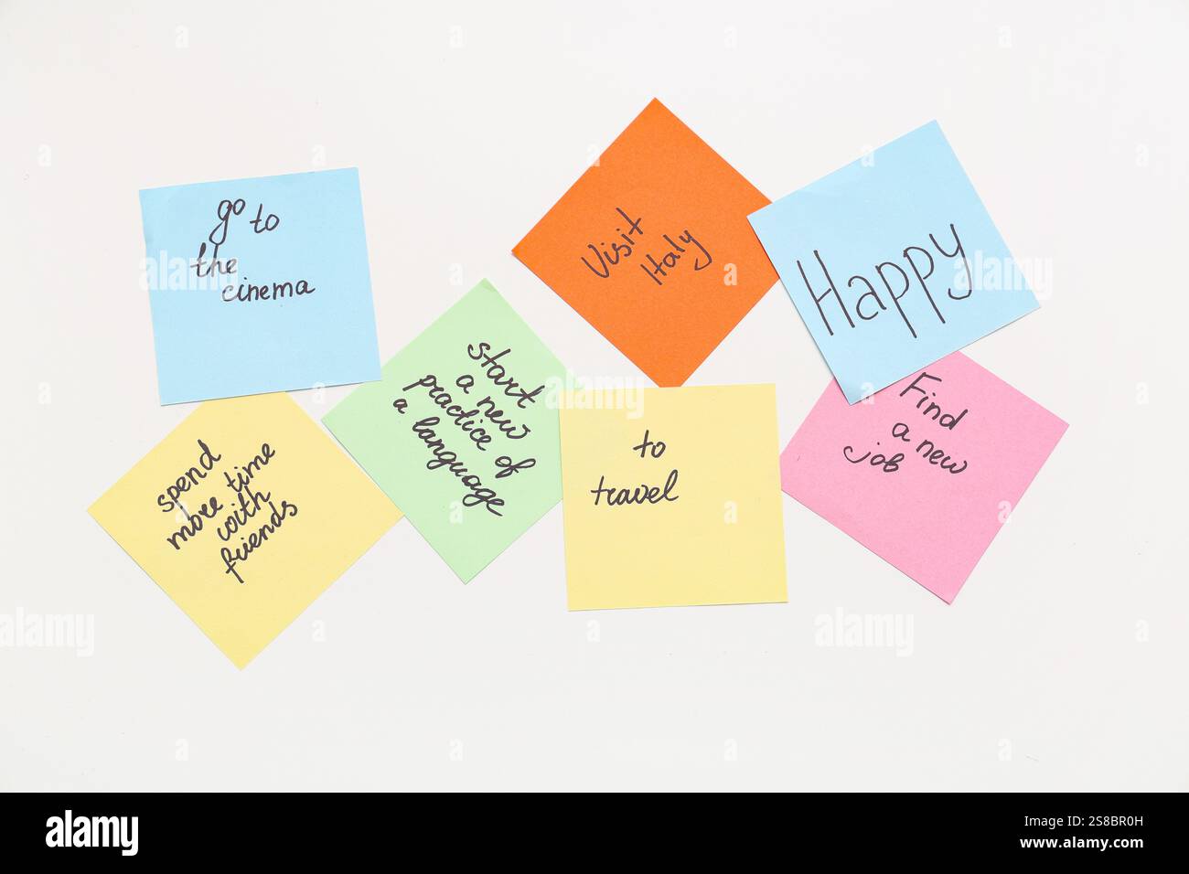 Different sticky notes with plans on white background Stock Photo - Alamy