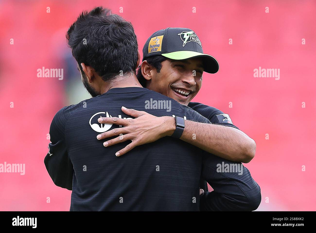Sydney, Australia. 22nd Jan, 2025. Muhammad Hasnain of the Thunder embraces with fellow ...