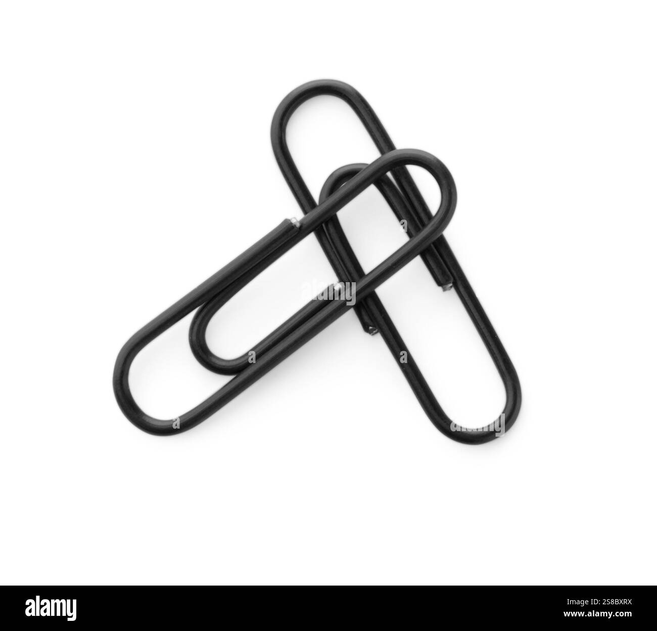 Two black paper clips isolated on white, top view Stock Photo - Alamy