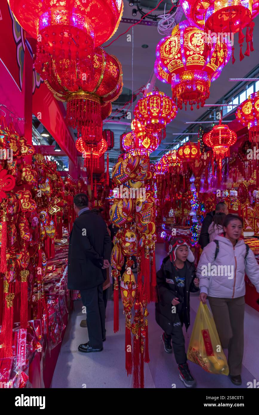People select Spring Festival decorations at a market in Jilin City ...