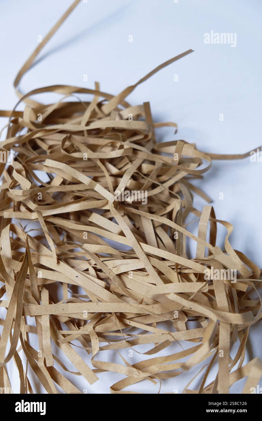 Shredded brown paper packaging material Stock Photo - Alamy