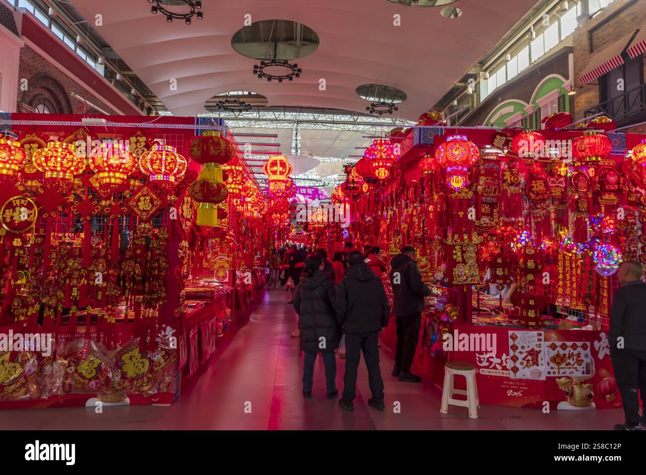 People select Spring Festival decorations at a market in Jilin City ...