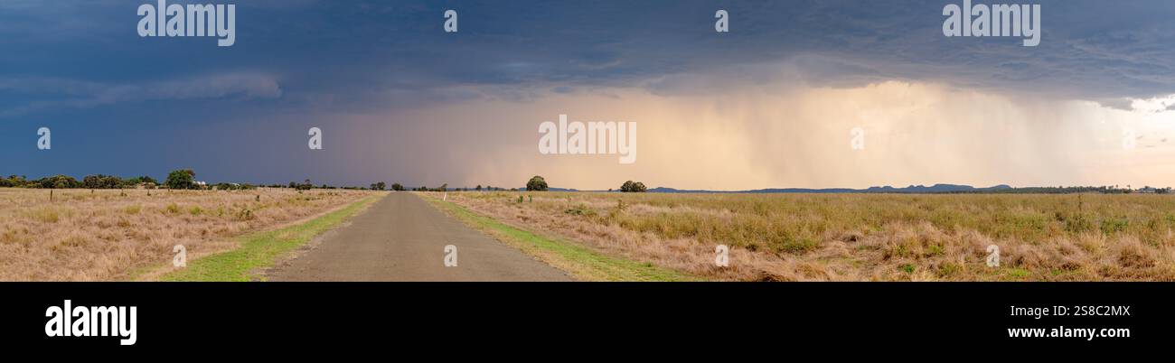 pano panorama storms rain over outback rural fields, road to horizon ...