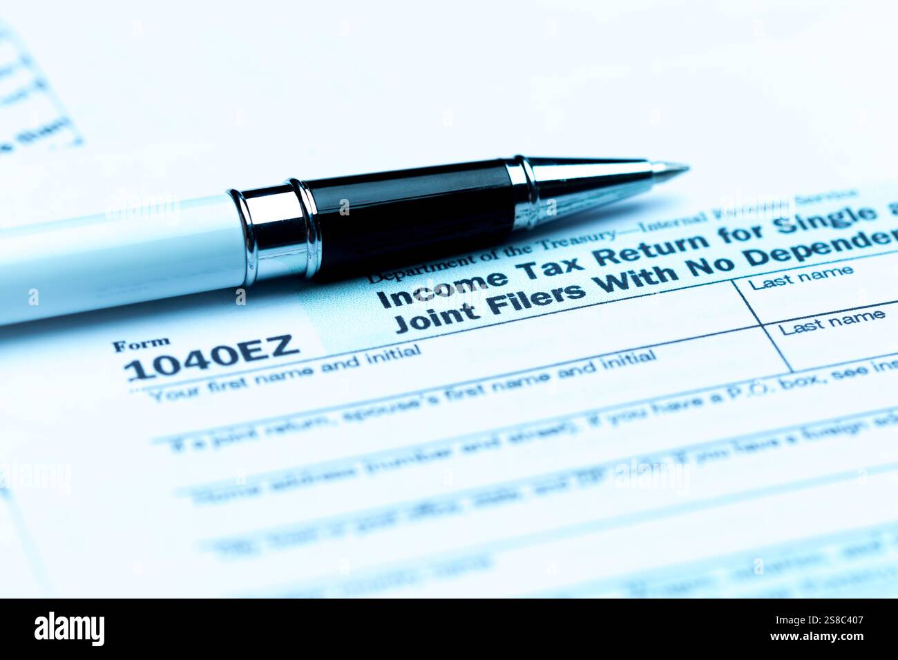 US tax form with pen Stock Photo - Alamy