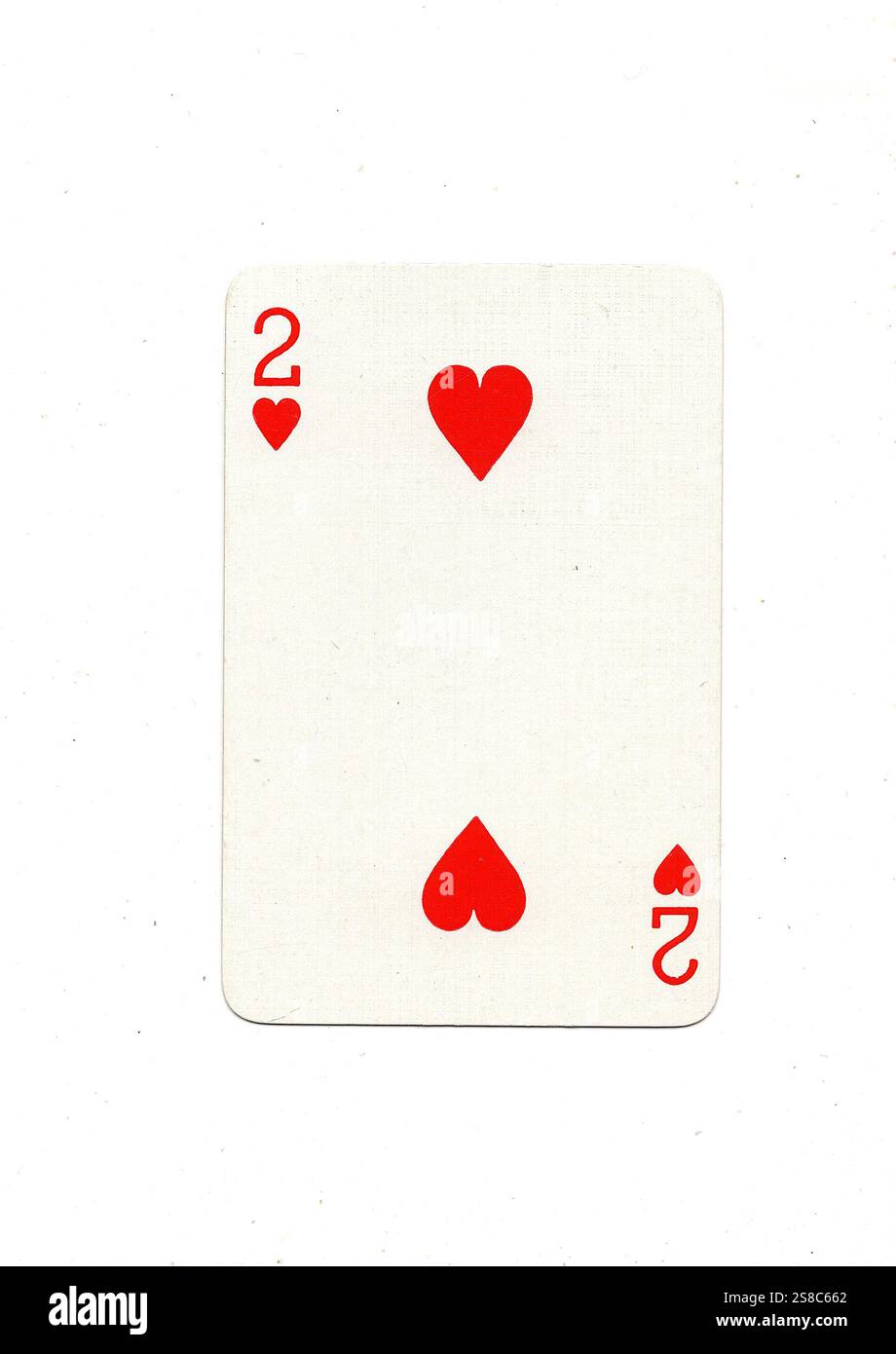 A vintage two of hearts playing card isolated on a white background ...