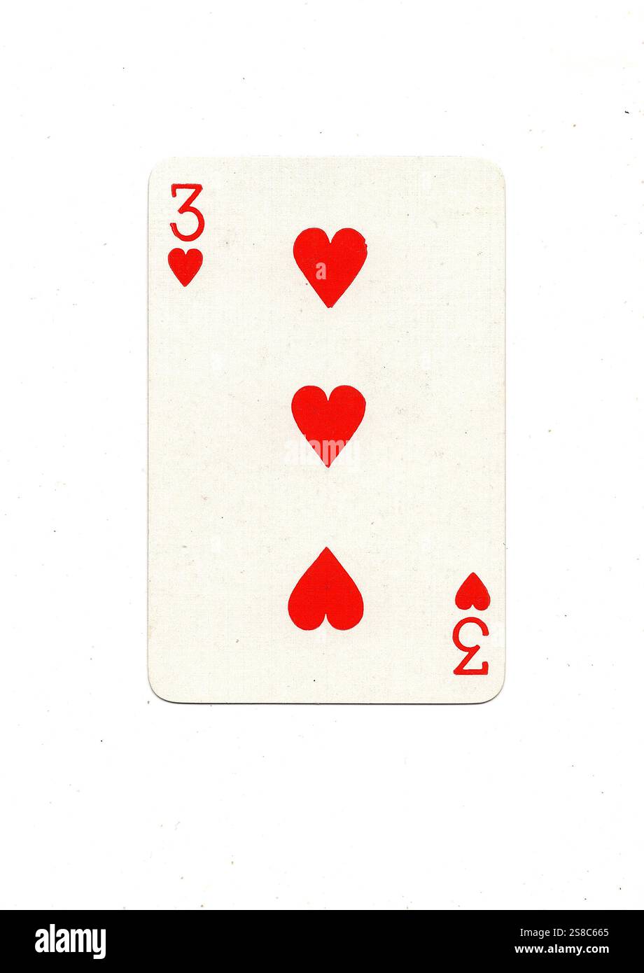 A vintage three of hearts playing card isolated on a white background ...