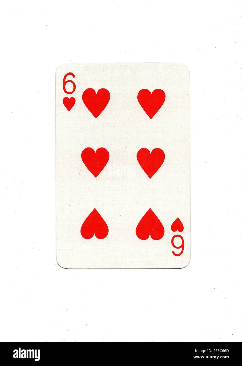 A vintage six of hearts playing card isolated on a white background ...