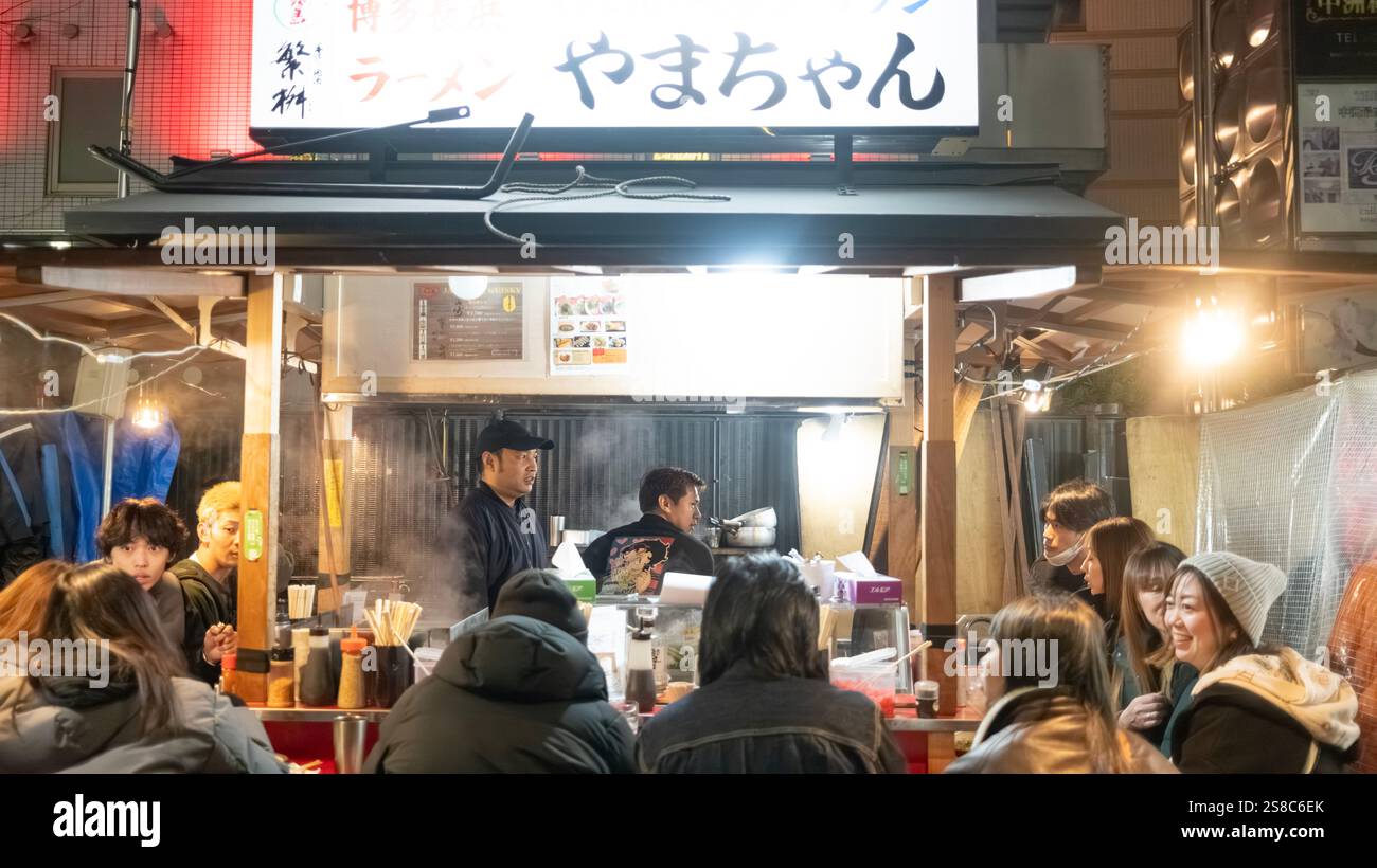 Fukoka, Japan- January 18 2024: people have a meal in Yatai Food Stalls ...