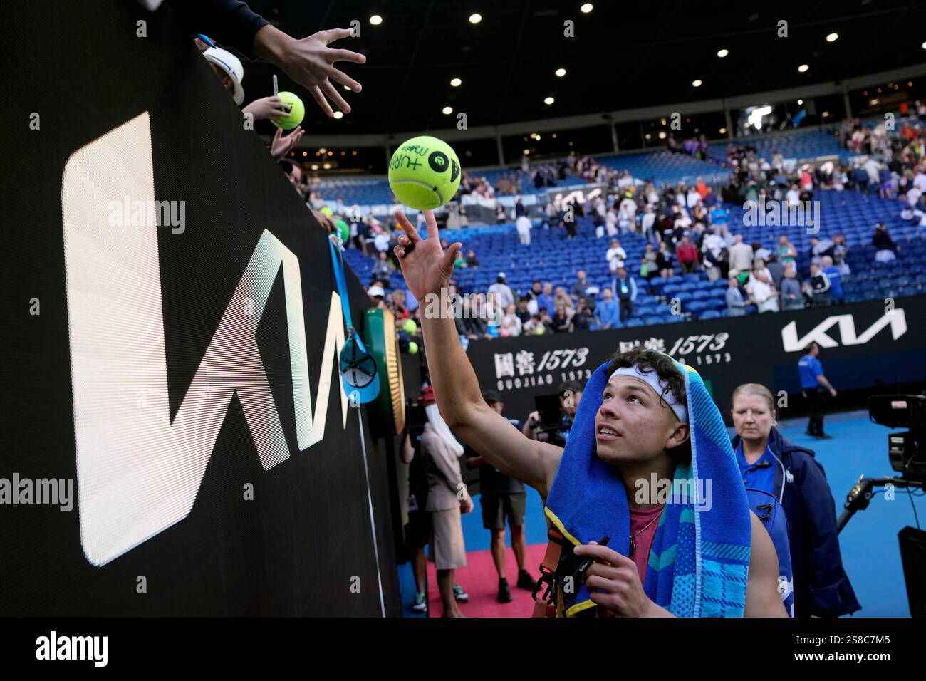 Ben Shelton of the U.S. signs autographs after defeating Lorenzo Sonego ...