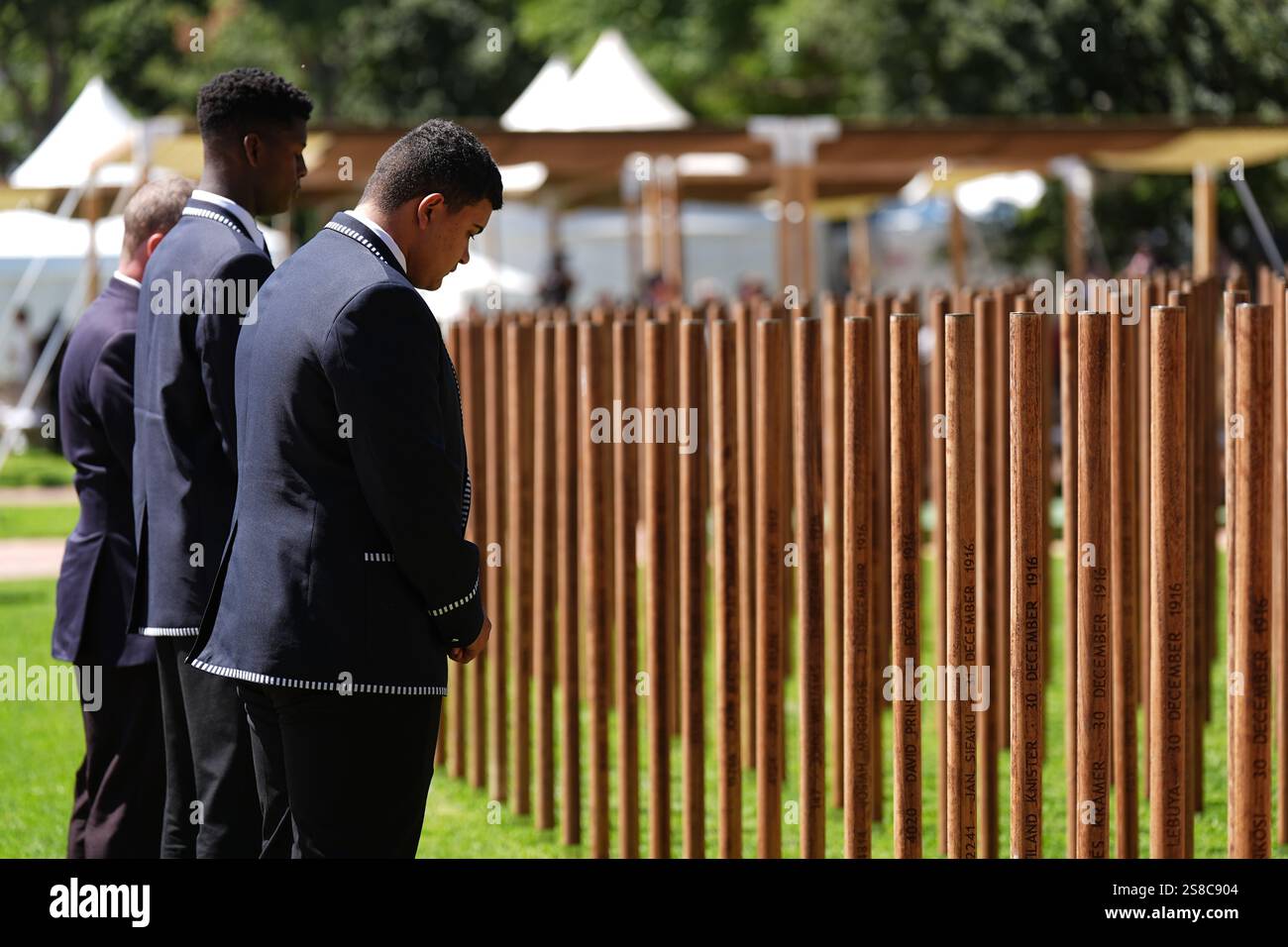 People pay their respects at the new Labour Corps Memorial at the ...