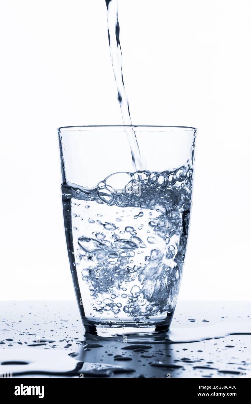 water splashing from glass isolated on white background Stock Photo - Alamy