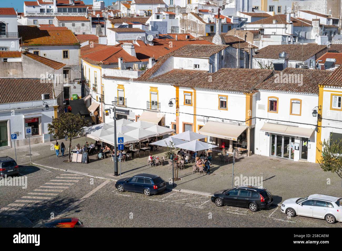 Evora, Portugal, 11-19-2024 People sitting at quaint cafe tables ...