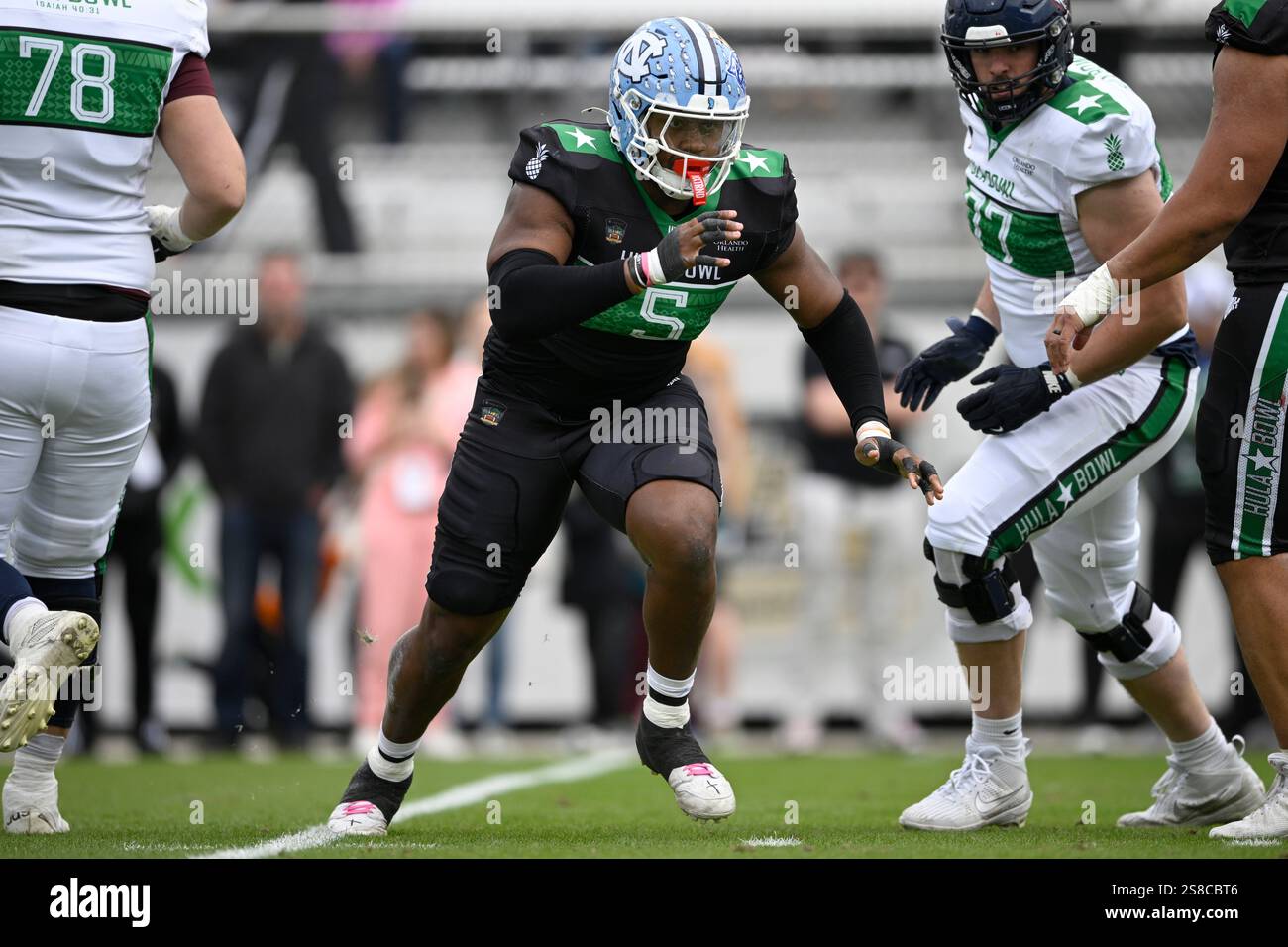 Team Aina defensive tackles Jahvaree Ritzie (5), of North Carolina ...