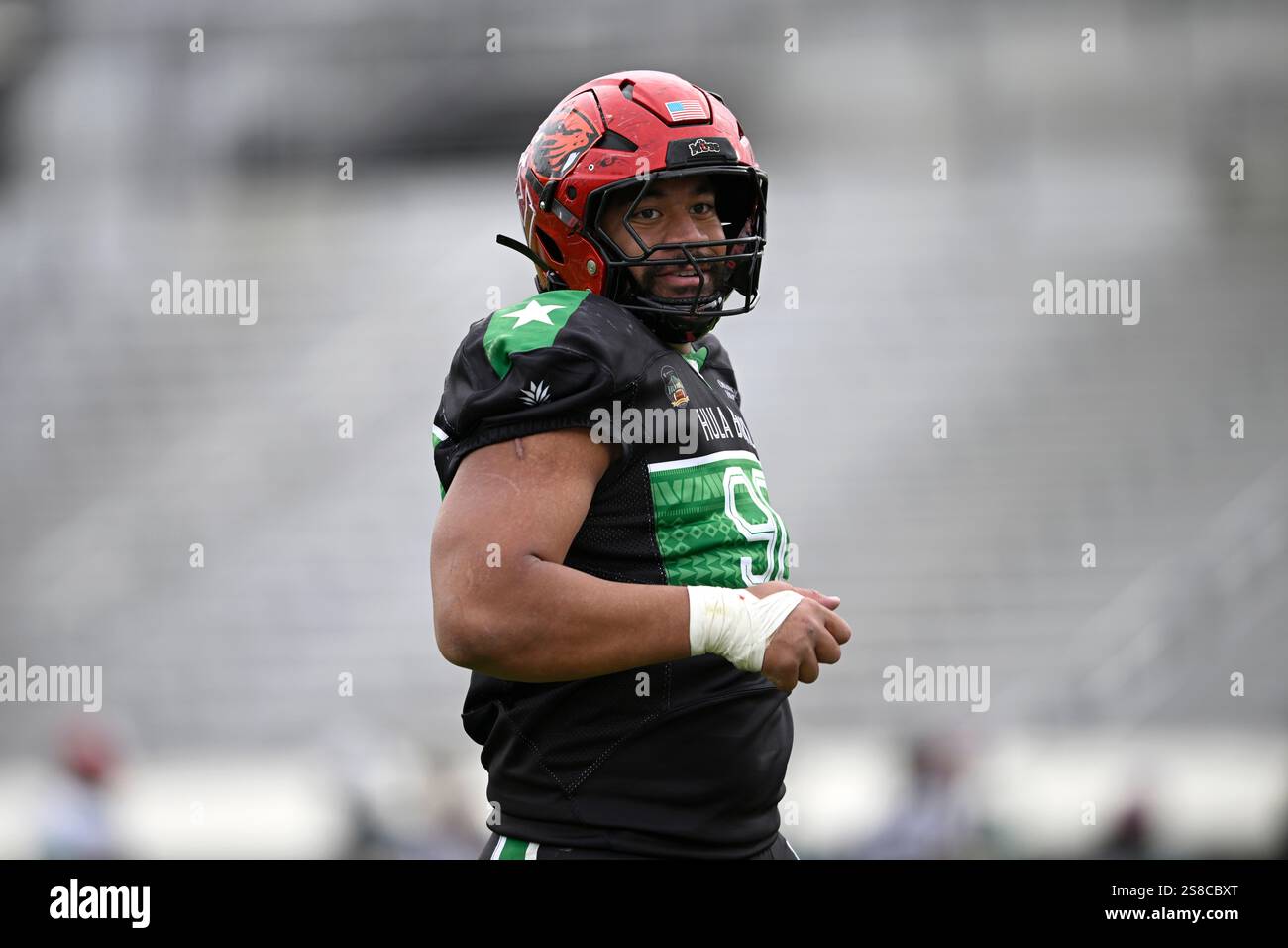 Team Aina defensive tackle Junior Tafuna (90), of Utah, sets up for a ...