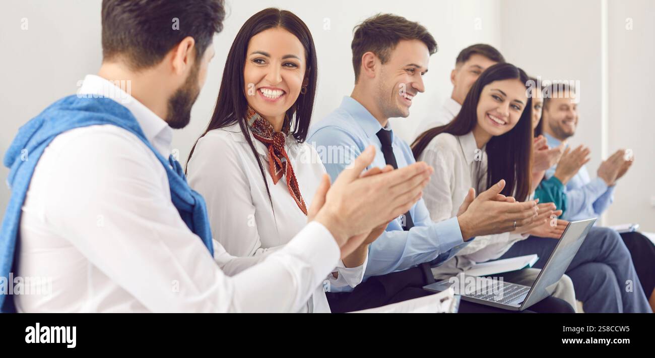Happy young candidates, diverse employees applauding, clapping hands ...