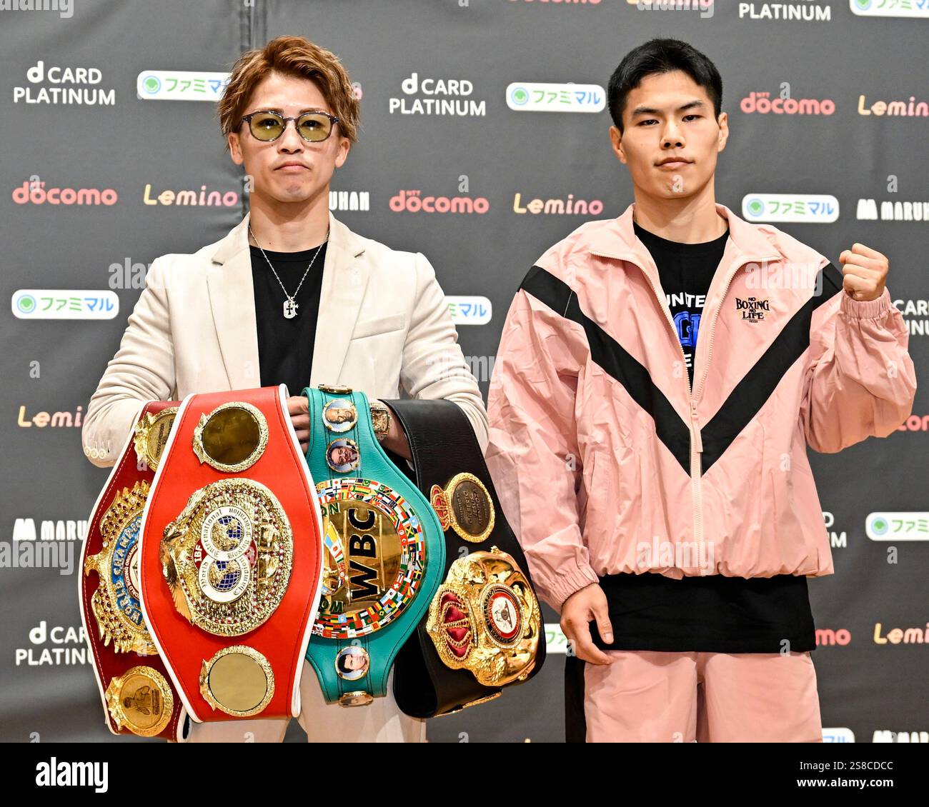Super-bantamweight world champion Japan's Naoya Inoue (L) and South Korea's Kim Ye-joon attend a ...