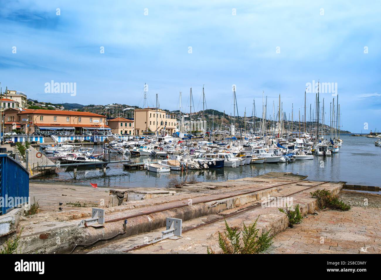Boat harbour with slipway and houses on the waterfront of Sanremo ...