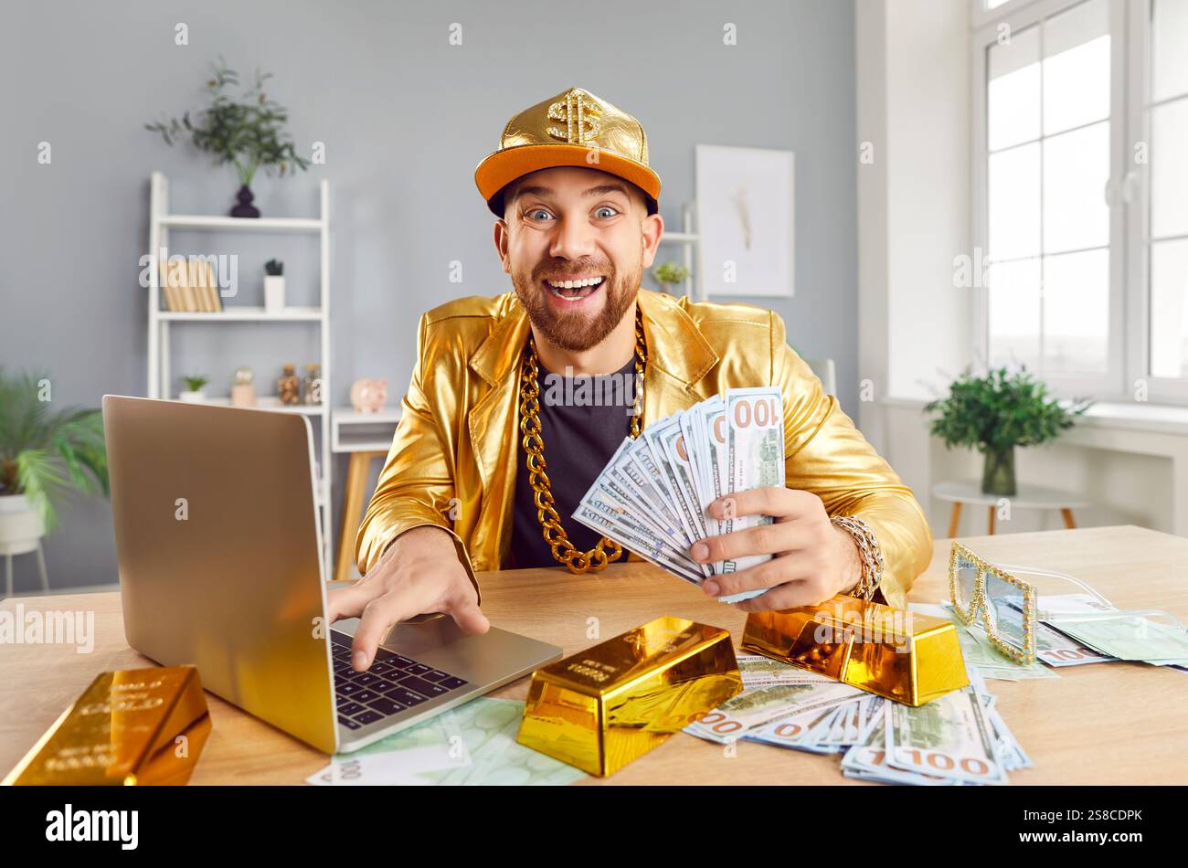Successful Rich Man In Gold Suit With Cash And Laptop Stock Photo - Alamy