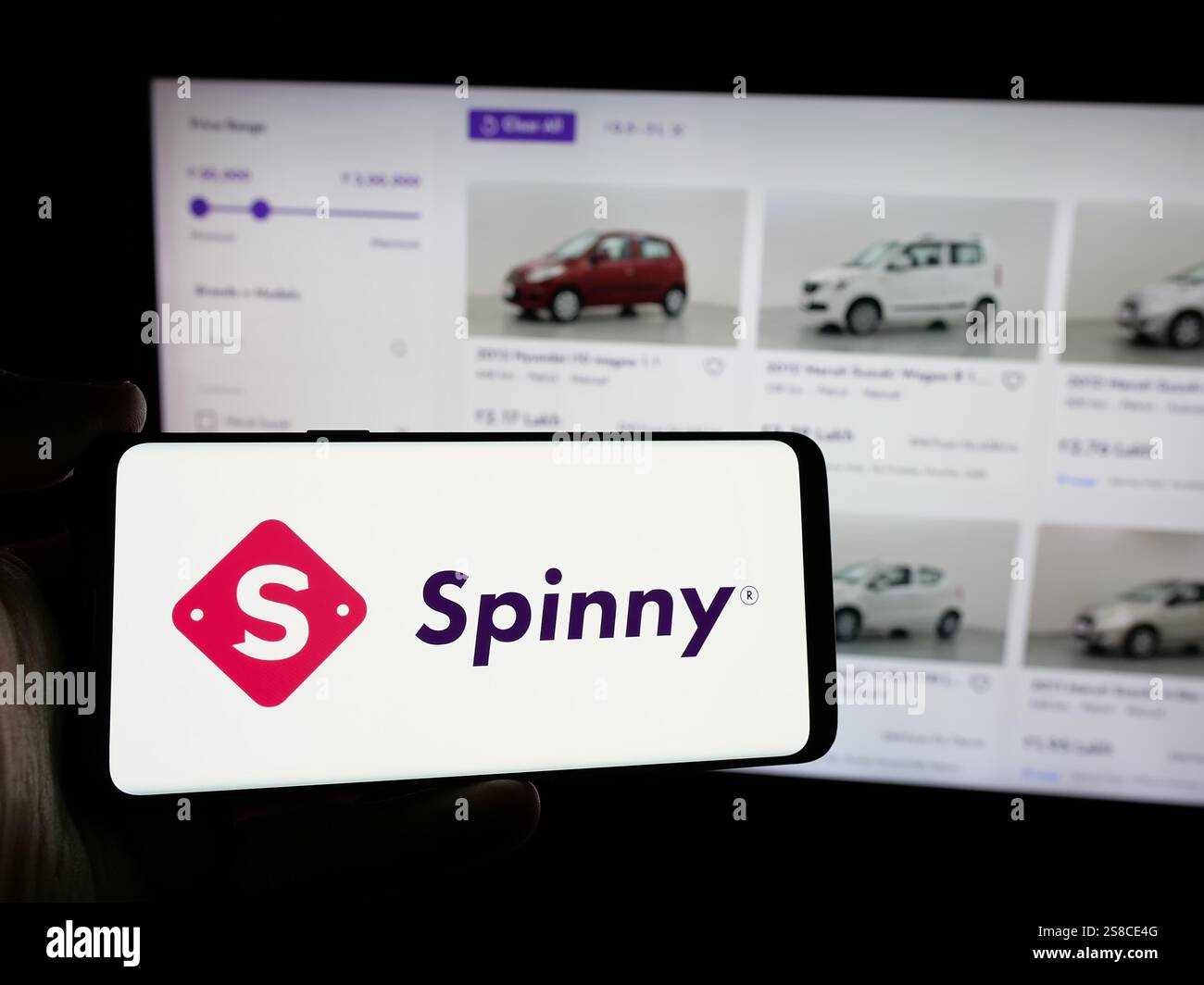 Germany. 22nd Oct, 2024. In this photo illustration, a person is holding a smartphone with the ...