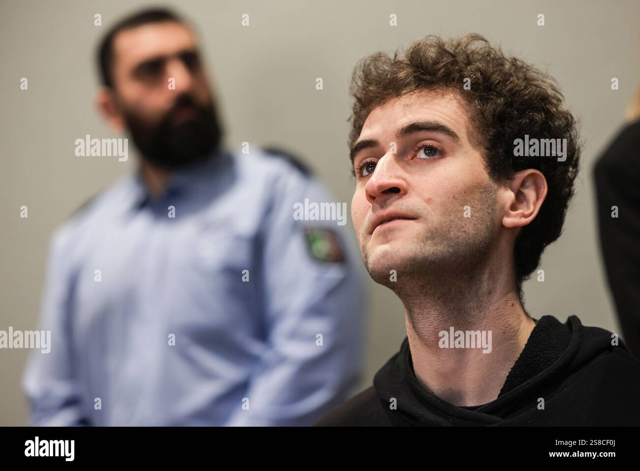 Erkelenz, Germany. 22nd Jan, 2025. The accused Loic Schneider (r) sits ...