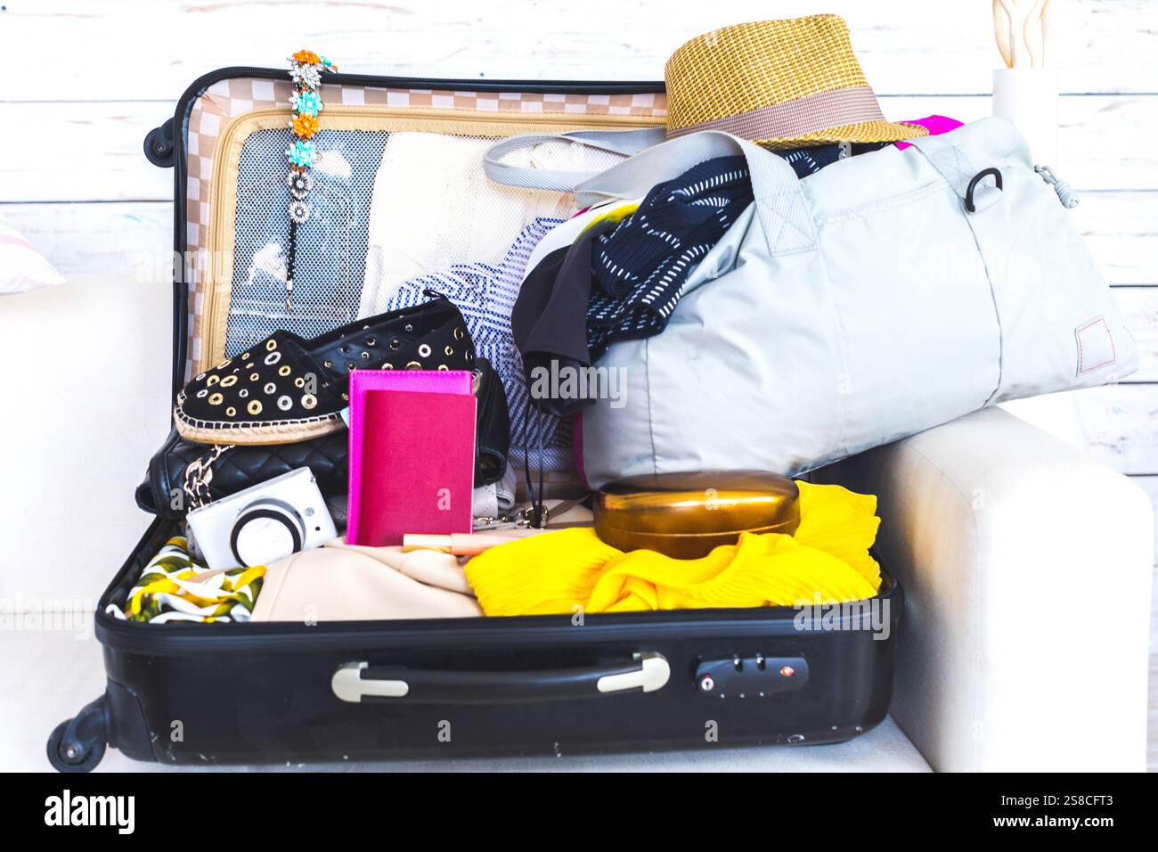 Packed suitcase of vacation items Stock Photo - Alamy