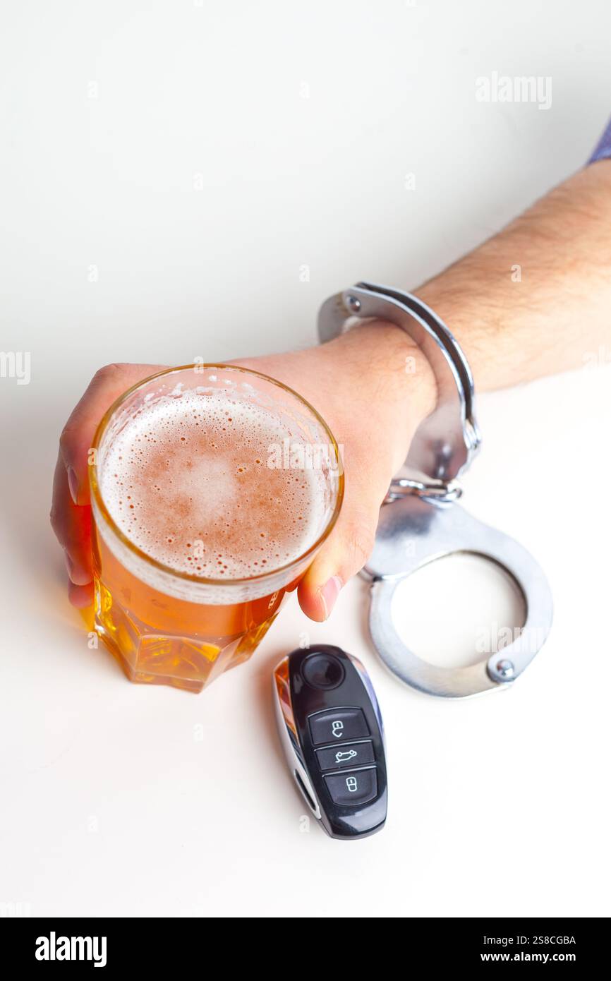 Drunk Driving Concept - Beer, Keys and Handcuffs Stock Photo - Alamy