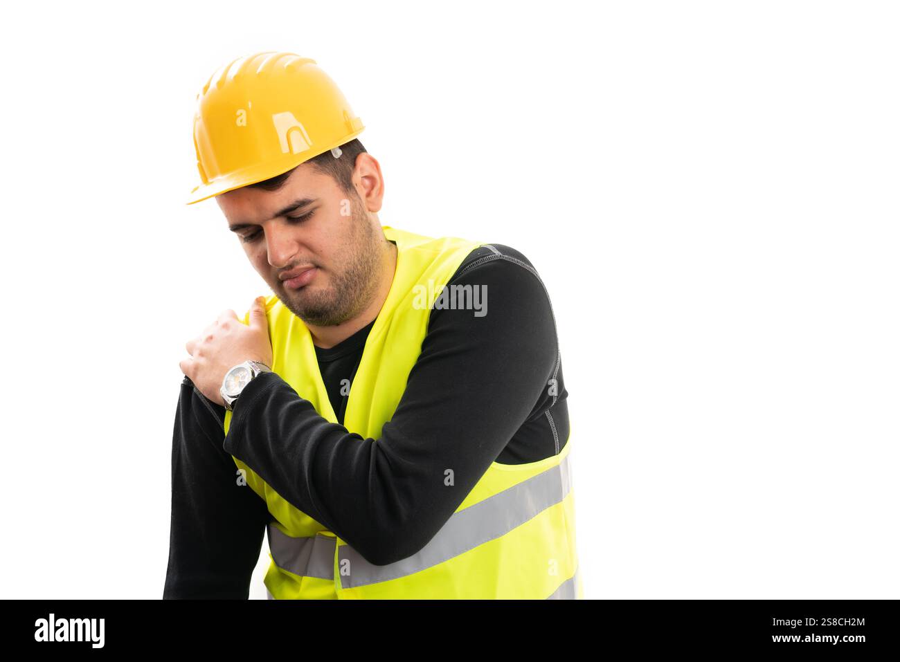 Adult male construction worker touching shoulder as pain at work ...