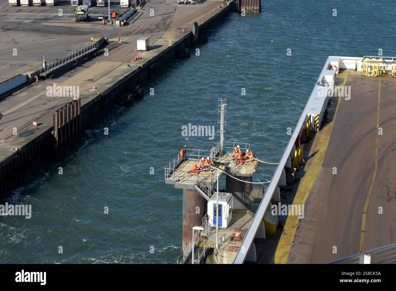 Dock workers releasing mooring lines for a Stena Line Ferry Harwich, UK ...