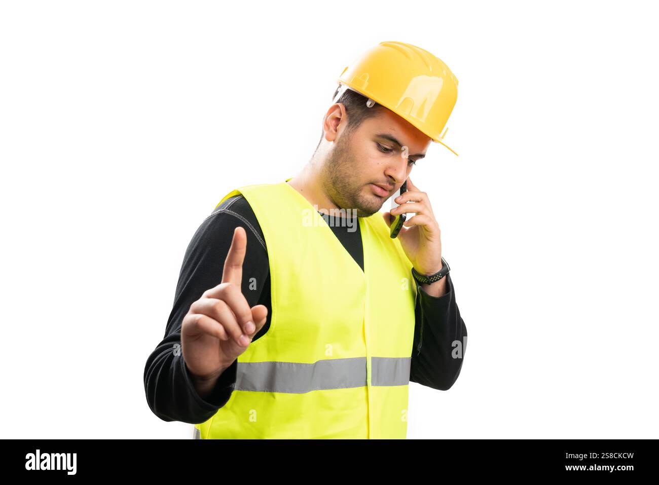 Busy male construction worker wearing fluorescent vest and yellow ...